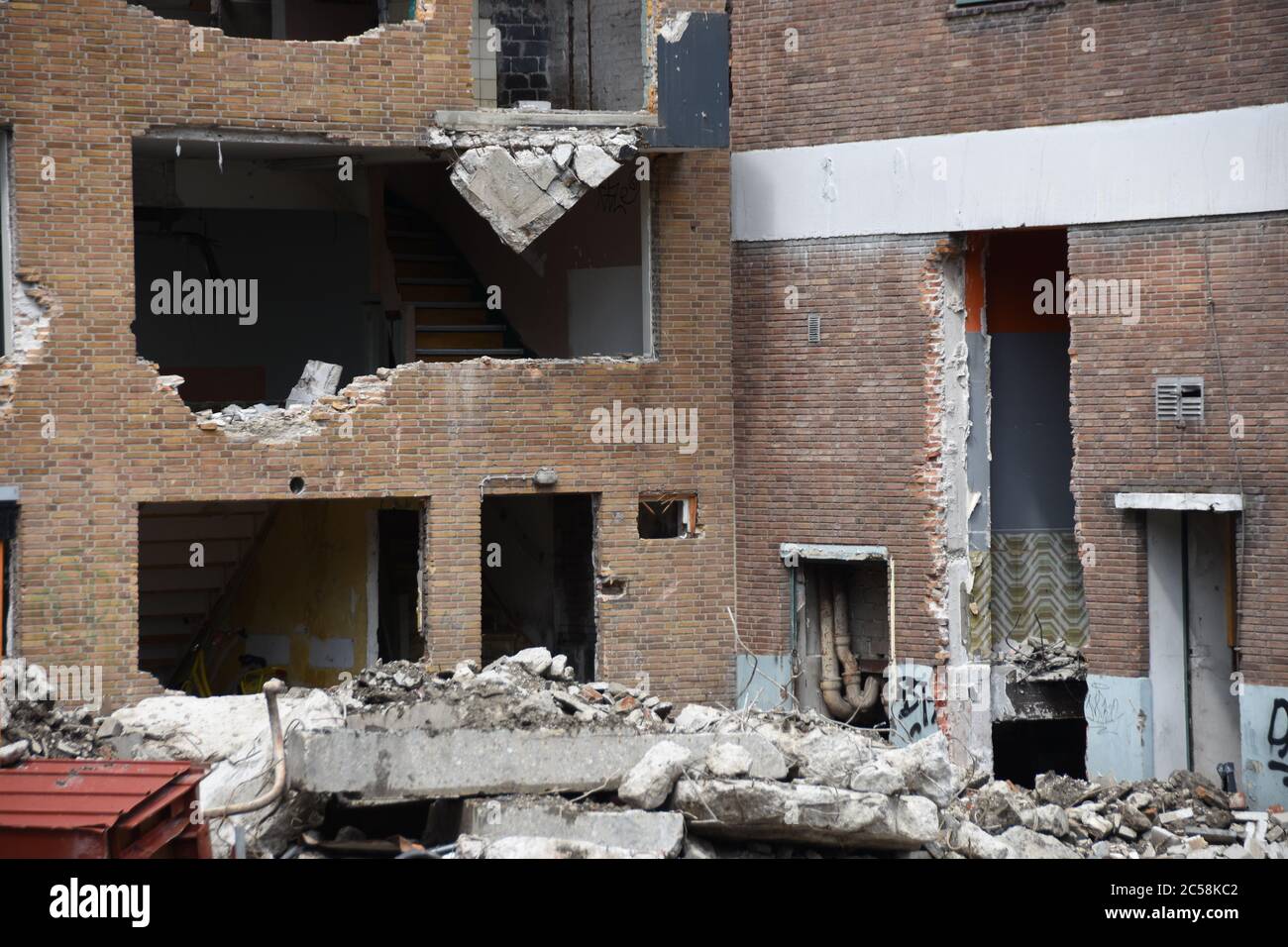 Demolition work on the red brick old house in the center of the town ...
