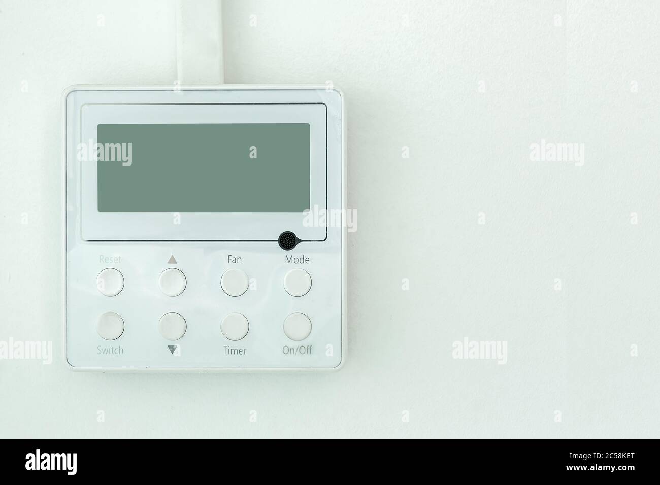 white wall air conditioning control panel with screen and control ...