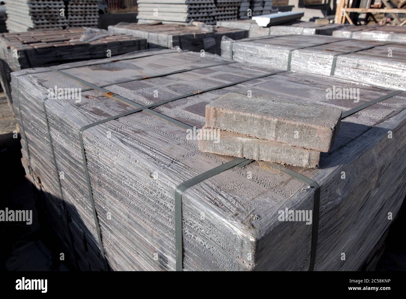 new paving stone tiles folded and packed in foil Stock Photo - Alamy