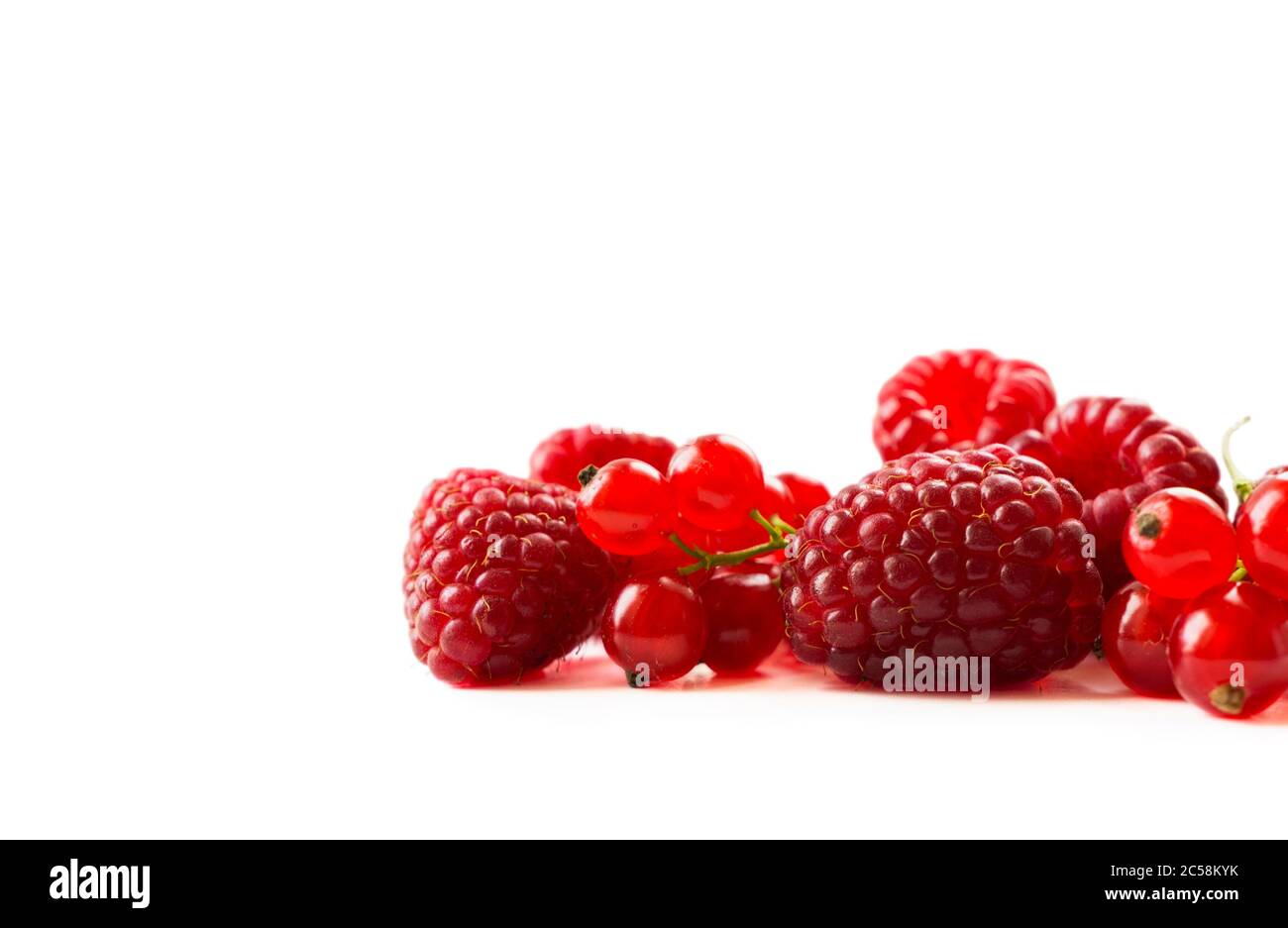 Red berries on white background. Ripe currants and raspberries. Ripe ...