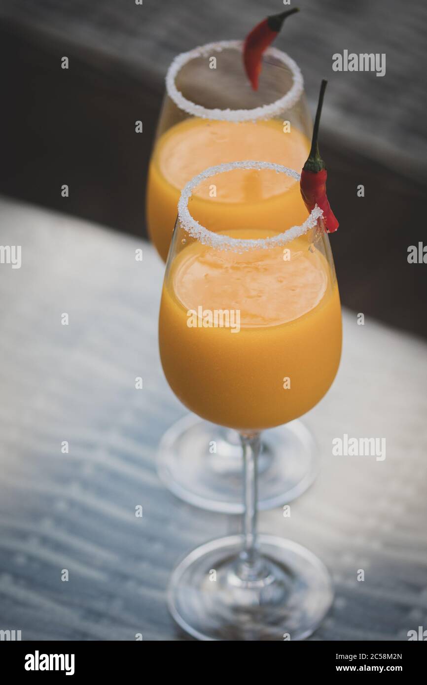 Glass of mango chilli martini or cocktail Stock Photo - Alamy