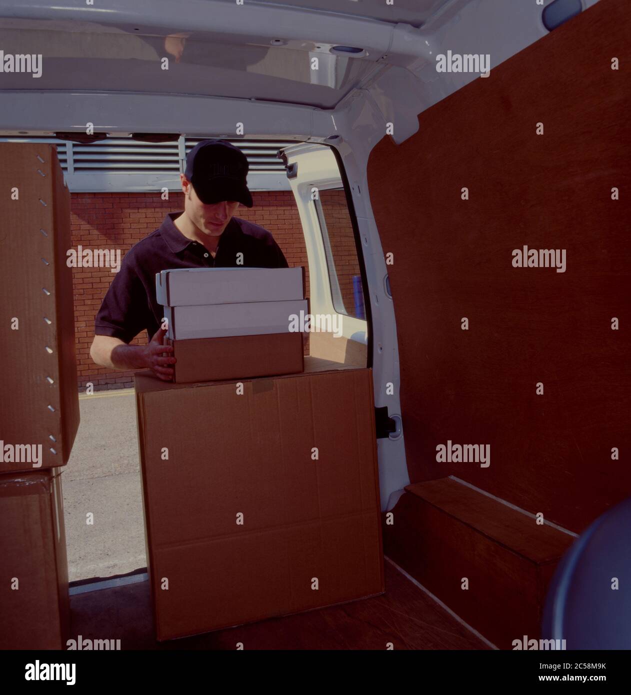 Delivery driver with boxes hi-res stock photography and images - Alamy