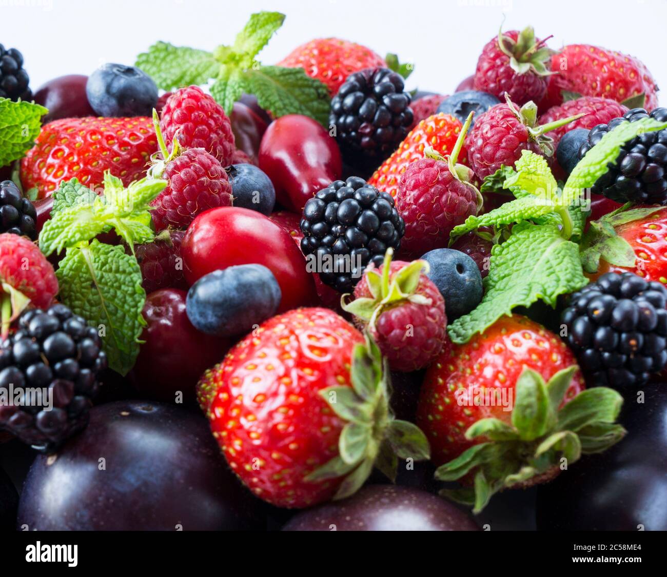 Various fresh summer berries and fruits. Ripe strawberries ...