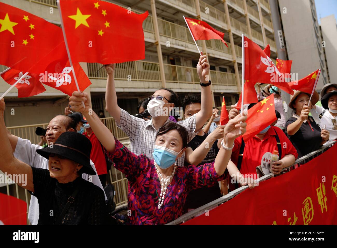 Hong Kong, China. 1st July, 2020. People watch a parade to celebrate ...