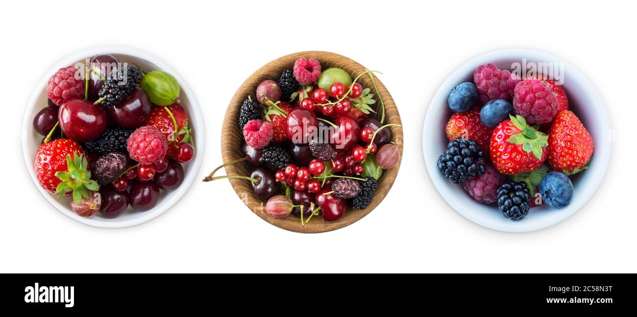 Top view. Fruits and berries in bowl isolated on white background. Ripe ...