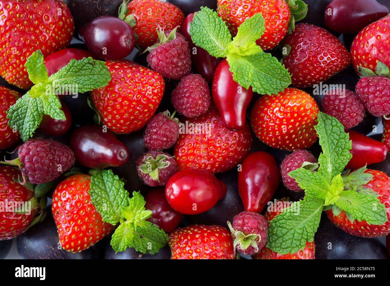 Top view. Various fresh summer berries and fruits. Ripe strawberries ...