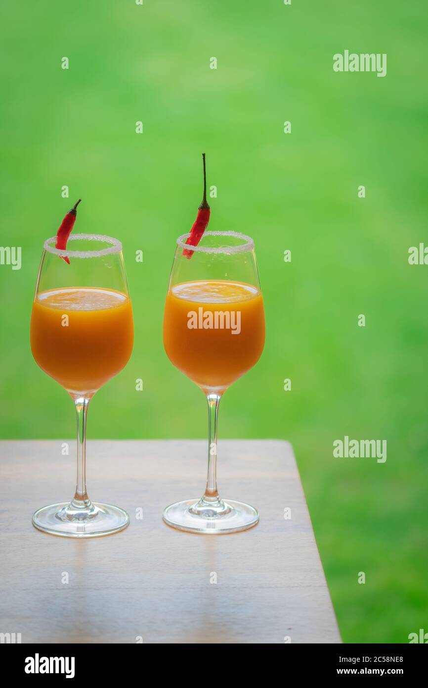 Glass of mango chilli martini or cocktail Stock Photo - Alamy