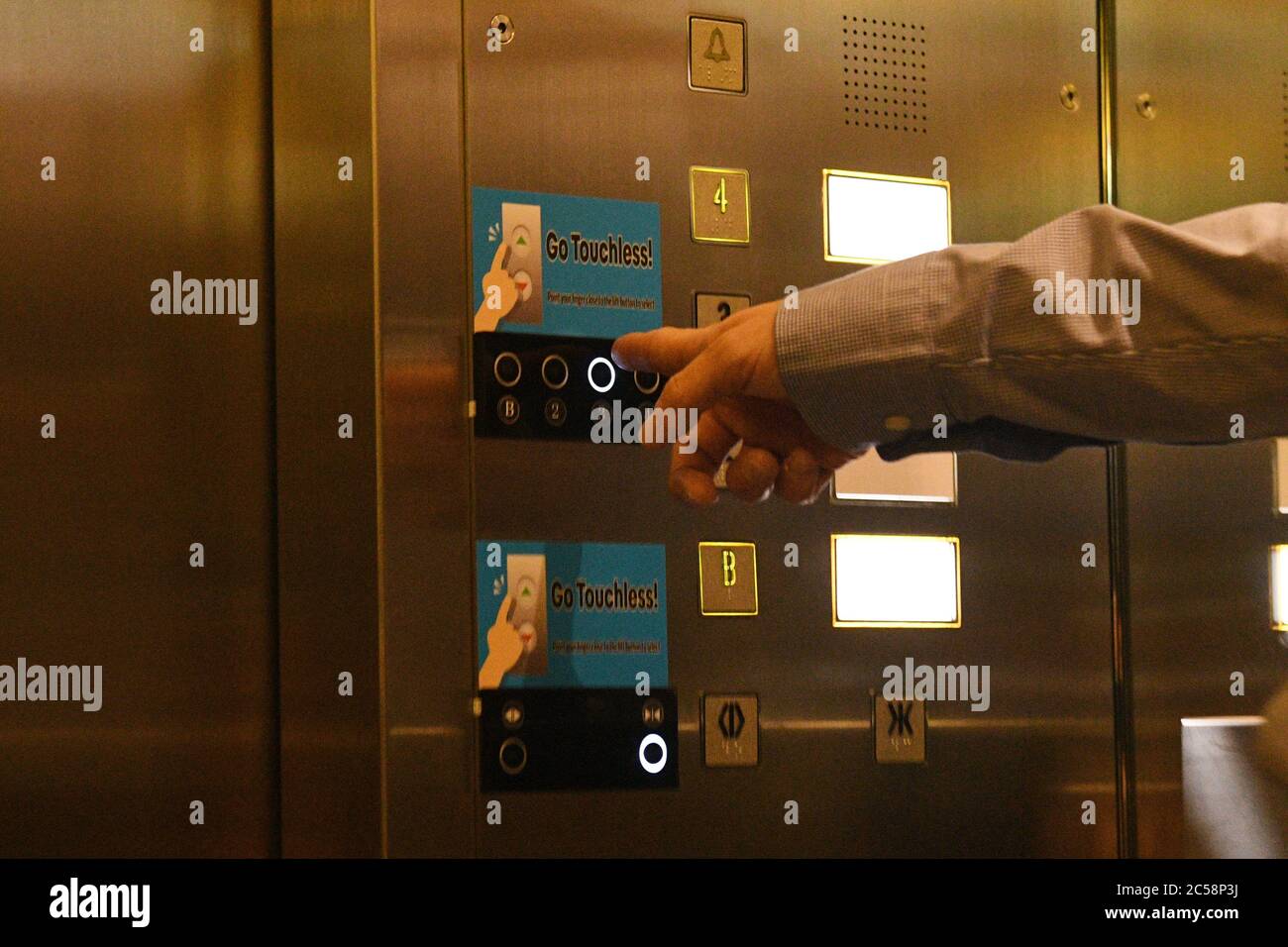 Singapore. 1st July, 2020. An airport staff member demonstrates how to ...