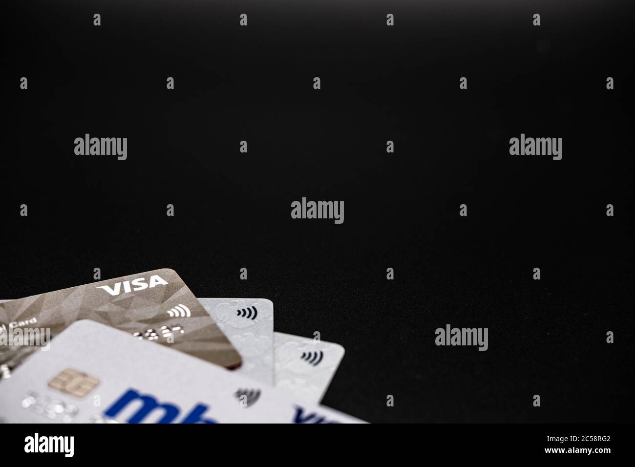 Stack of credit and debit cards from well-known finance companies ...