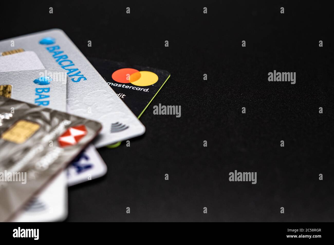 Stack of credit and debit cards from well-known finance companies ...