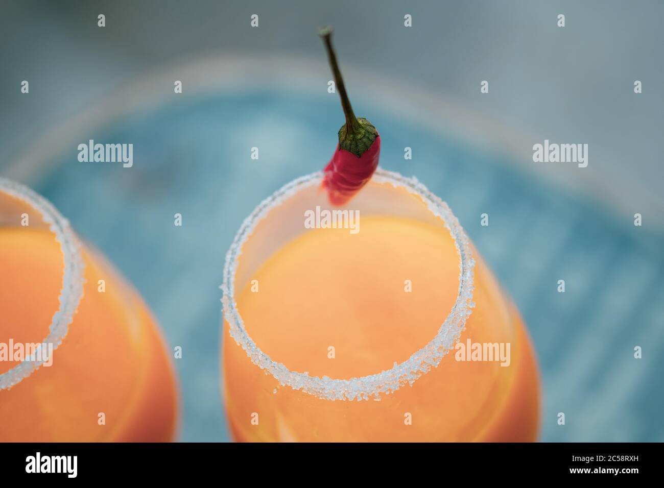 Glass of mango chilli martini or cocktail Stock Photo - Alamy