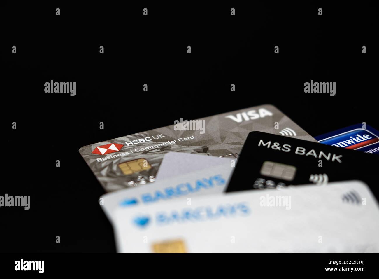 Stack of credit and debit cards from well-known finance companies ...