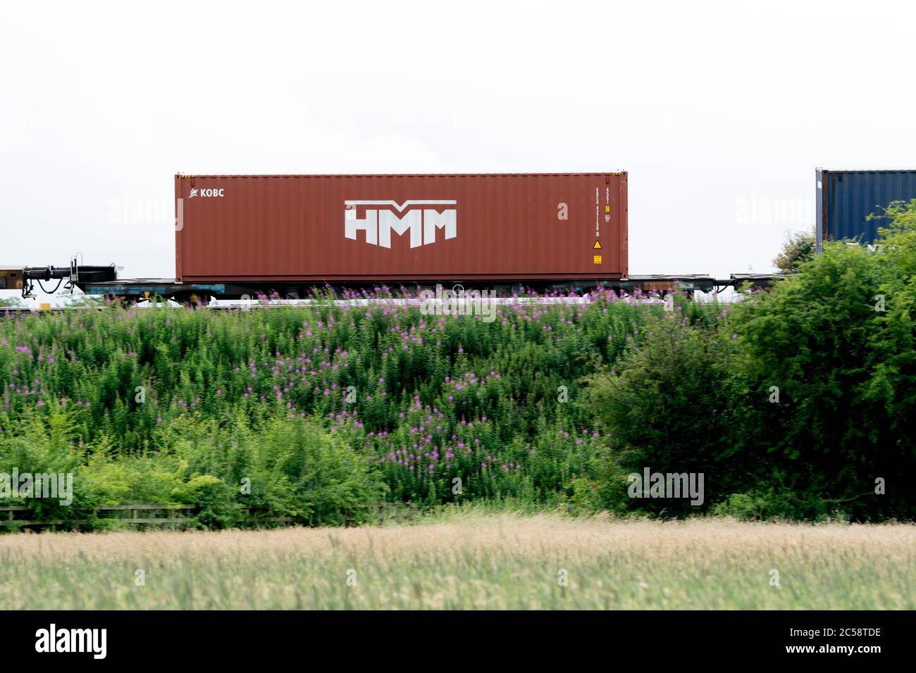 HMM shipping container on a freightliner train, Warwickshire, UK Stock ...