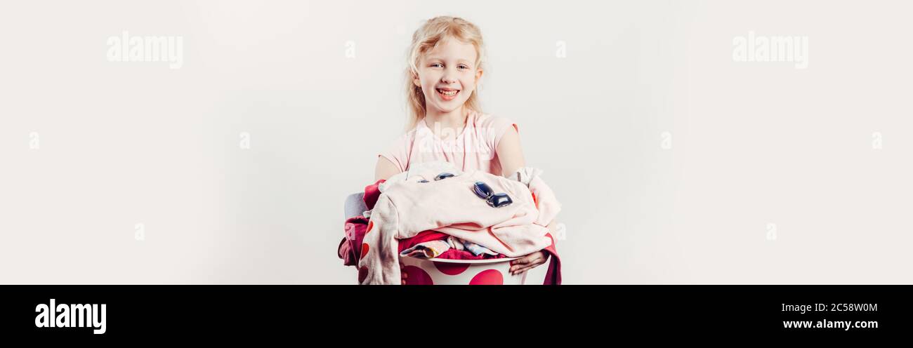 Mommy little helper. Smiling Caucasian girl child holding wash-basin ...