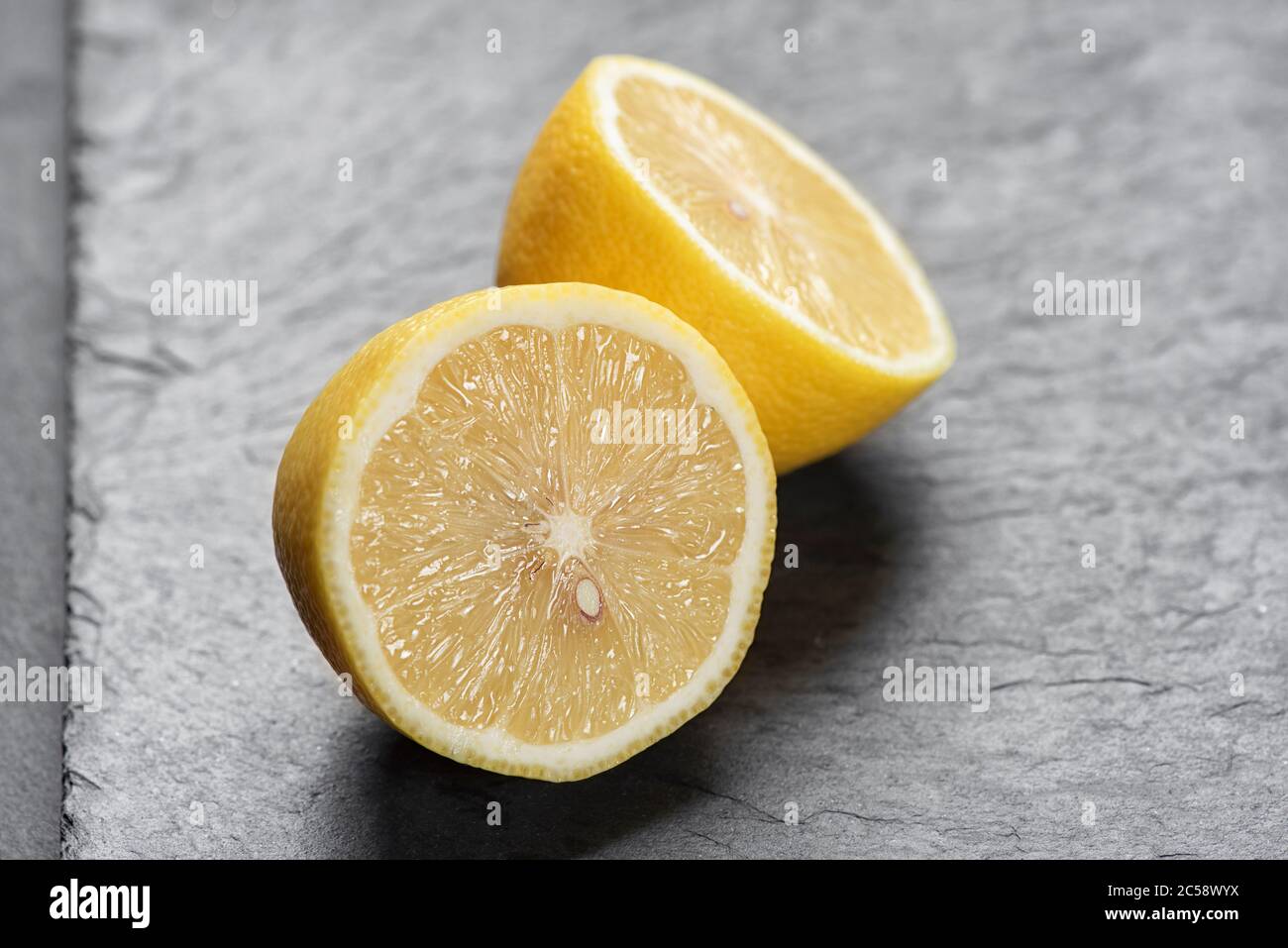 Fresh lemon on a grey stone board Stock Photo - Alamy