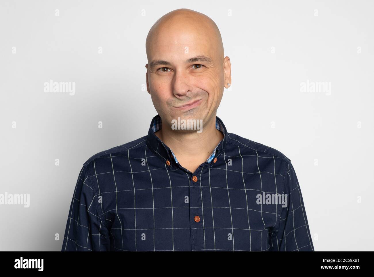 Studio portrait of a bald guy isolated Stock Photo - Alamy
