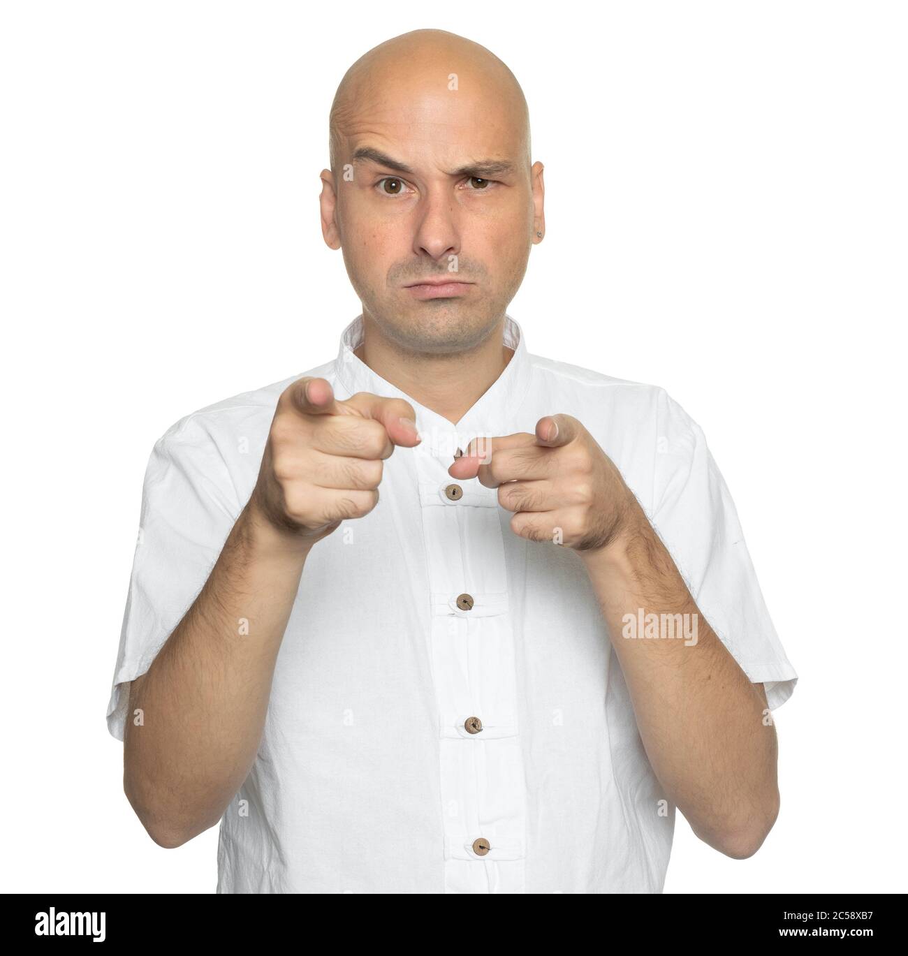 Serious bald man in casual white shirt is pointing fingers at you ...