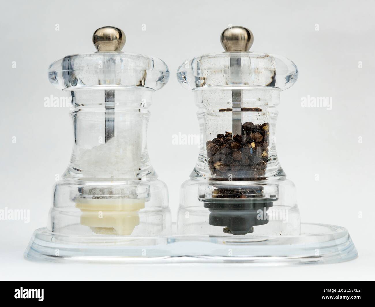 Salt and pepper cruet set against a white background Stock Photo - Alamy