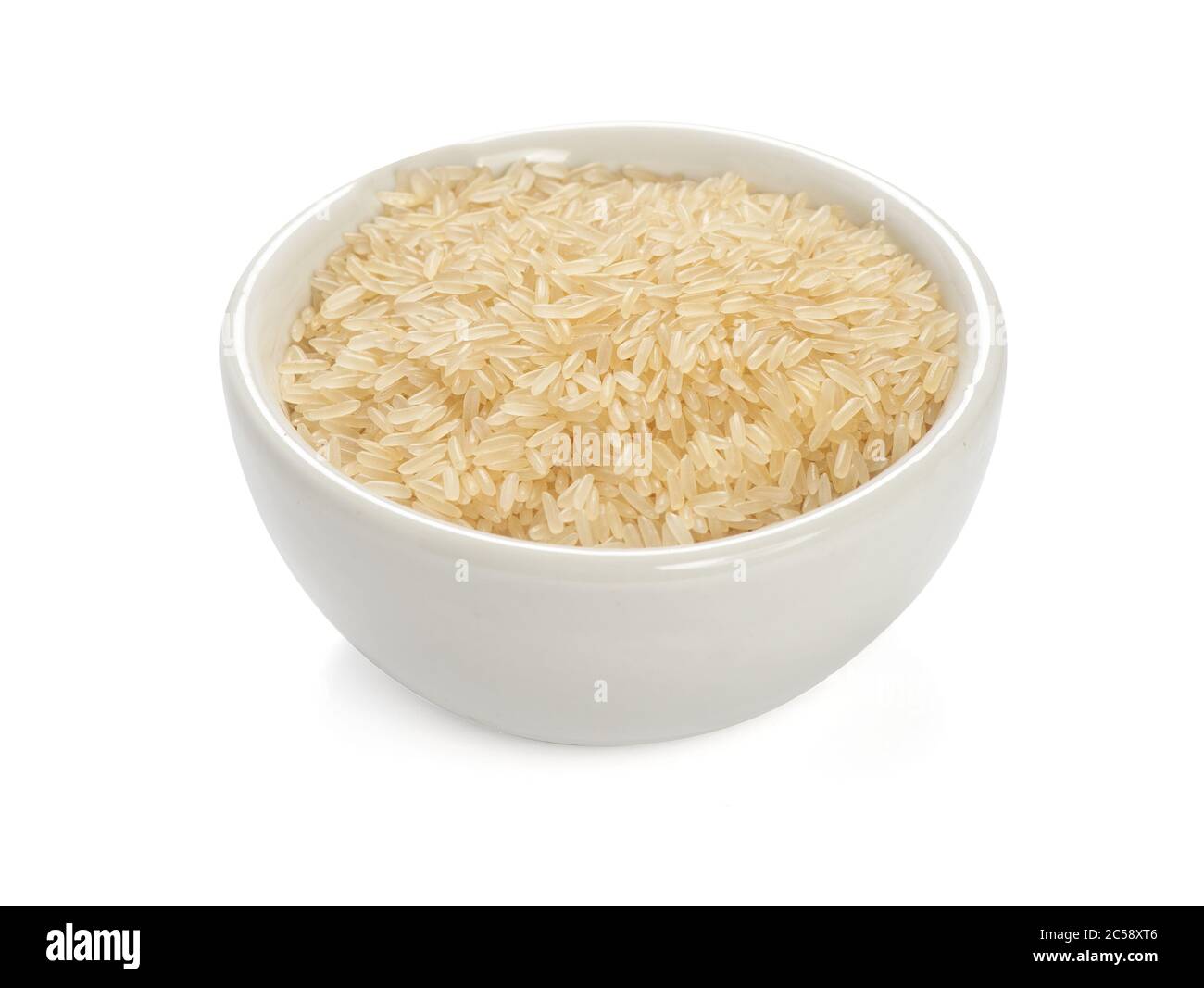 uncooked rice isolated on a white background Stock Photo - Alamy