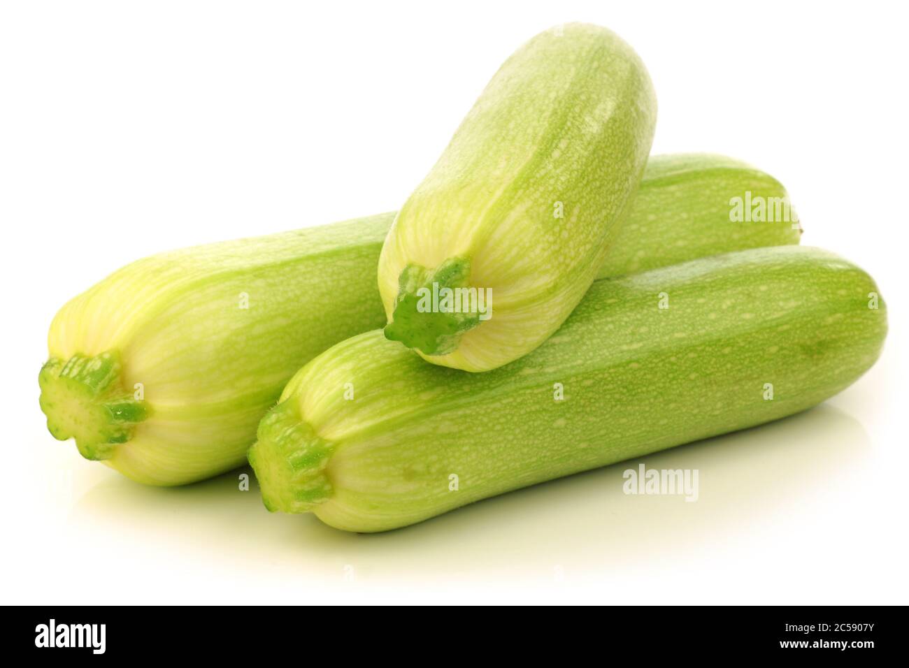 light green zucchini's (Cucurbita pepo) on a white background Stock ...