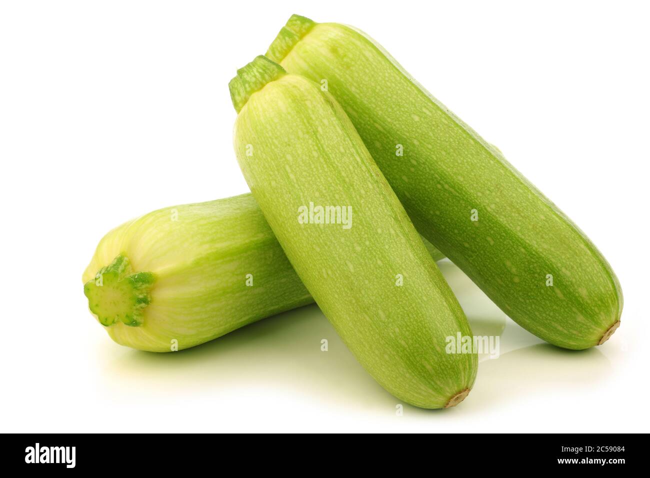 light green zucchini's (Cucurbita pepo) on a white background Stock ...