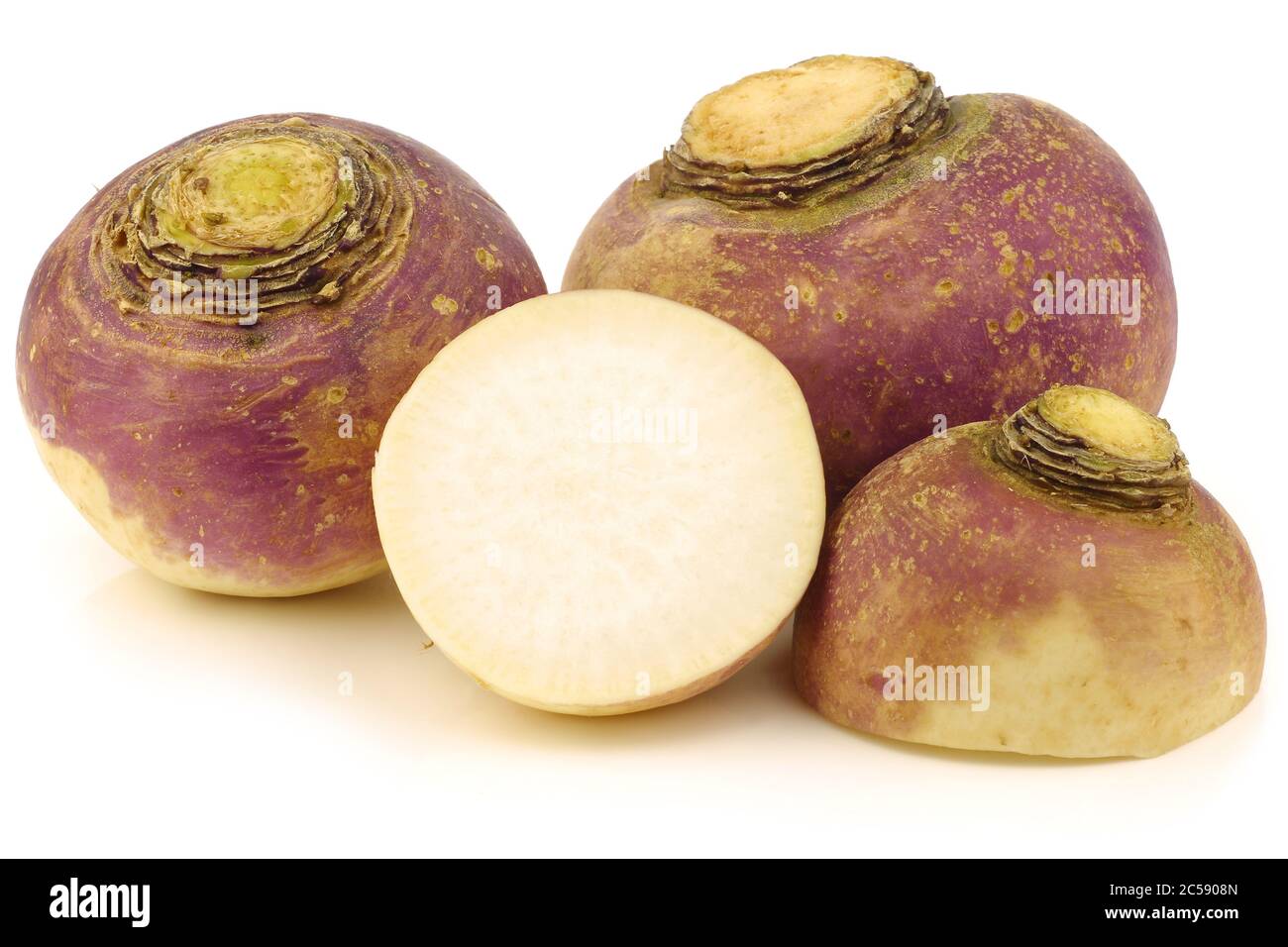fresh turnips and a cut one on a white background Stock Photo - Alamy