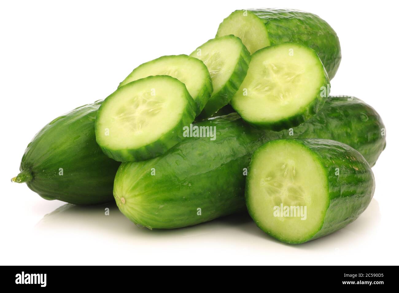 fresh turkish cucumber and a cut one on a white background Stock Photo ...