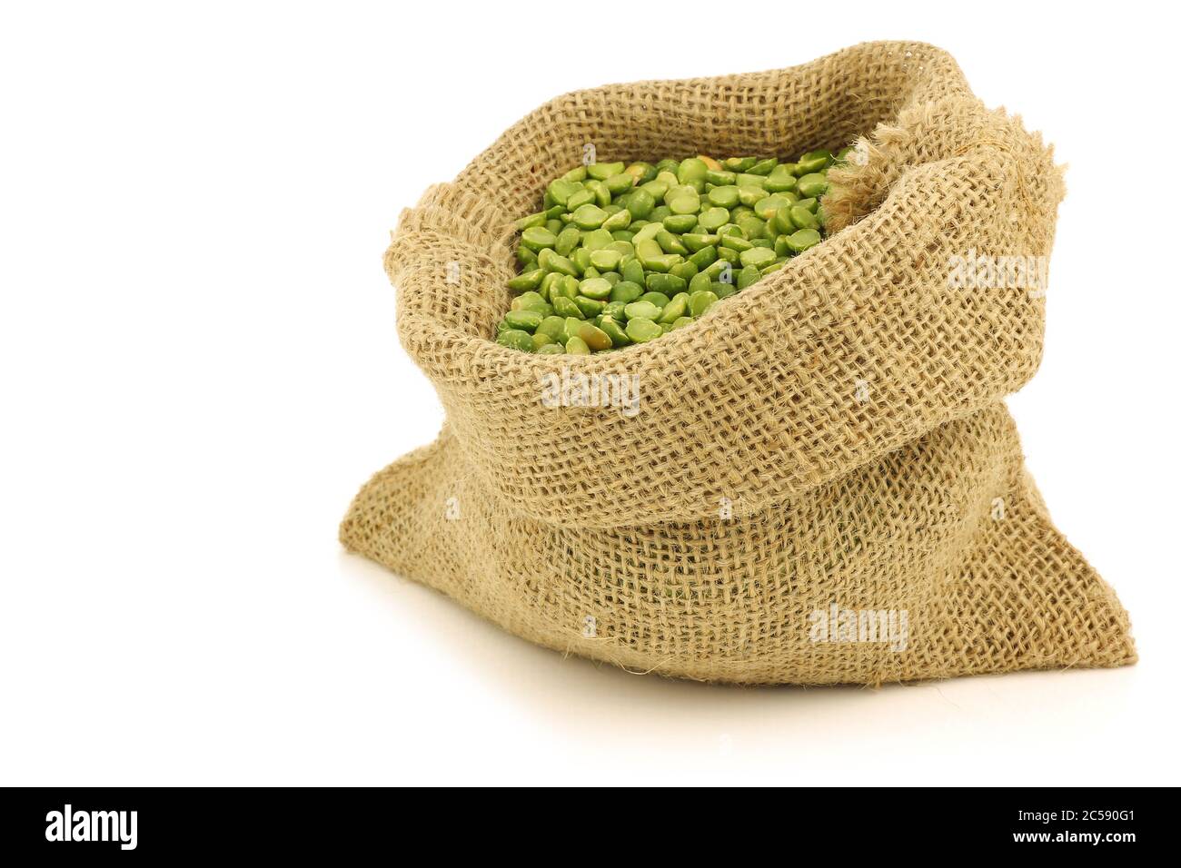 split green peas in a burlap bag on a white background Stock Photo - Alamy