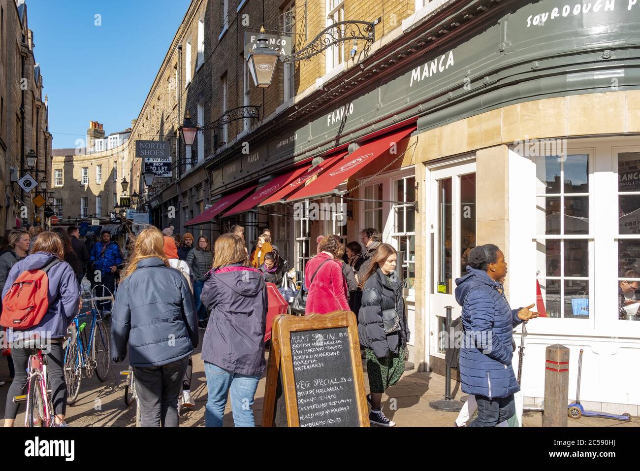 Busy weekend shopping day seen in the historic town of Cambridge ...