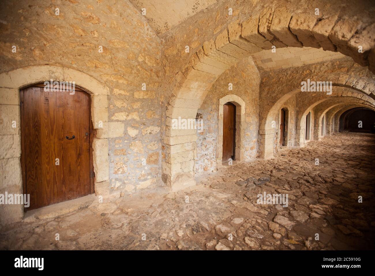 Arkadi Monastery in southern Crete Greece with palm trees, urns and ...