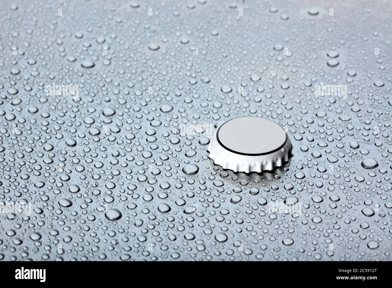blank bottle cap on metal surface with water droplets Stock Photo - Alamy