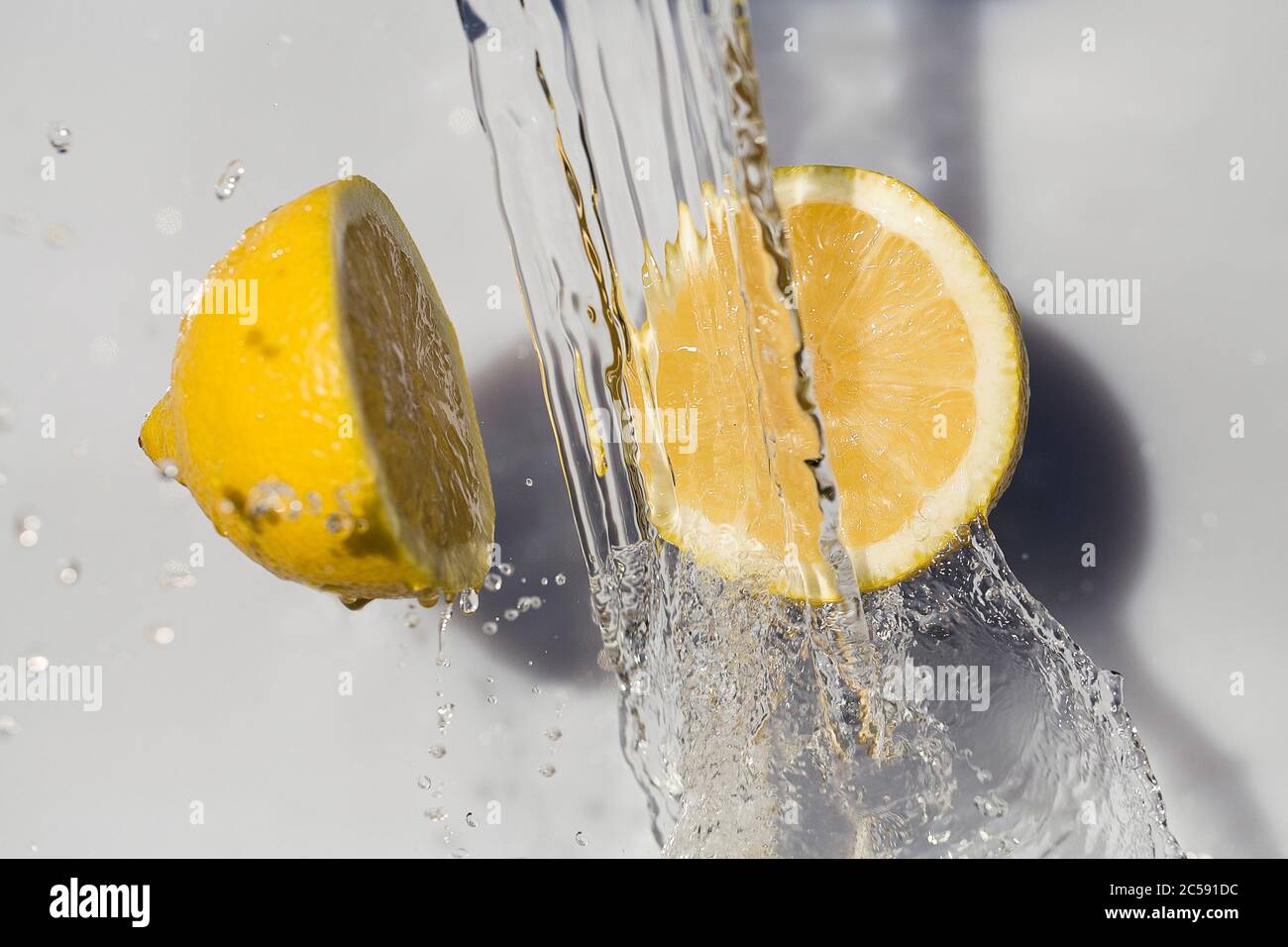 Fresh lemon and water splash on white background. summer concept Stock ...