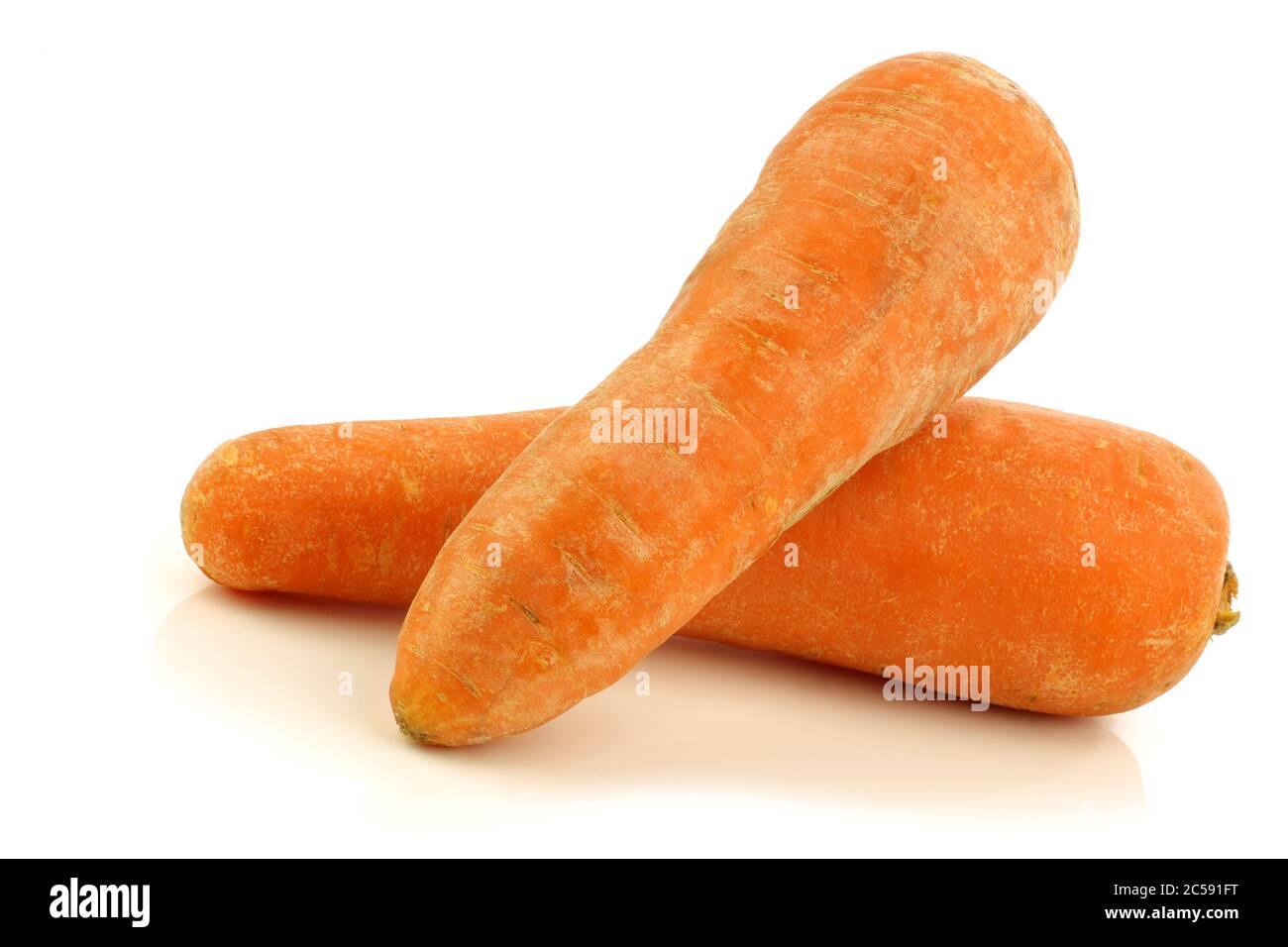 Winter carrots on a white background Stock Photo - Alamy