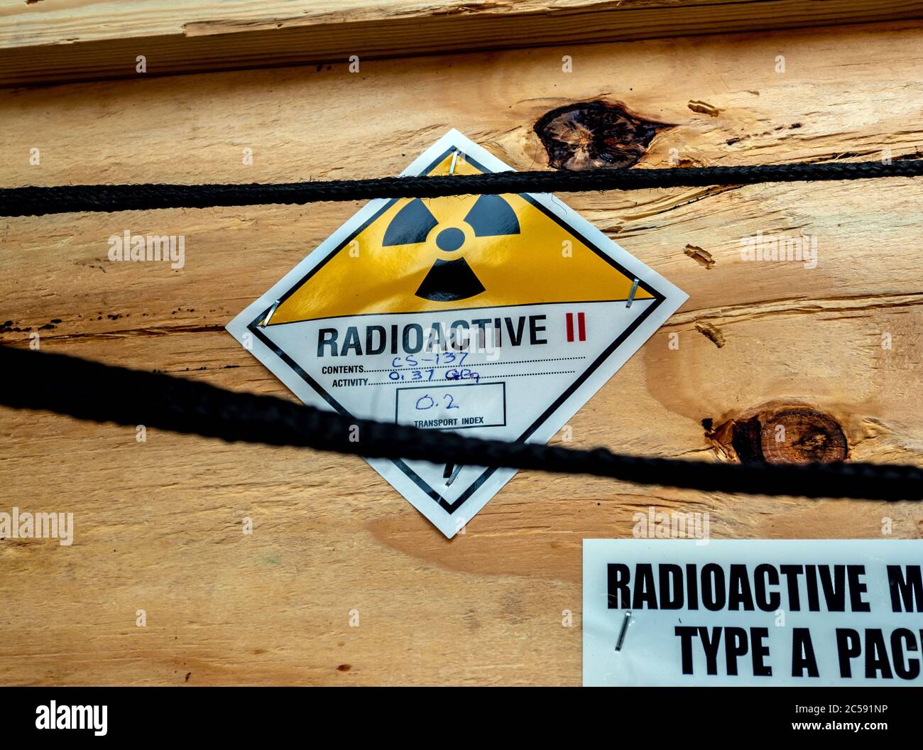 The radioactive material label beside the transportation wooden box ...