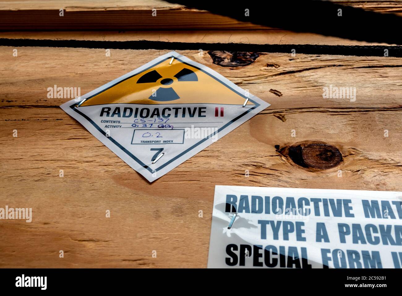 The radioactive material label beside the transportation wooden box ...
