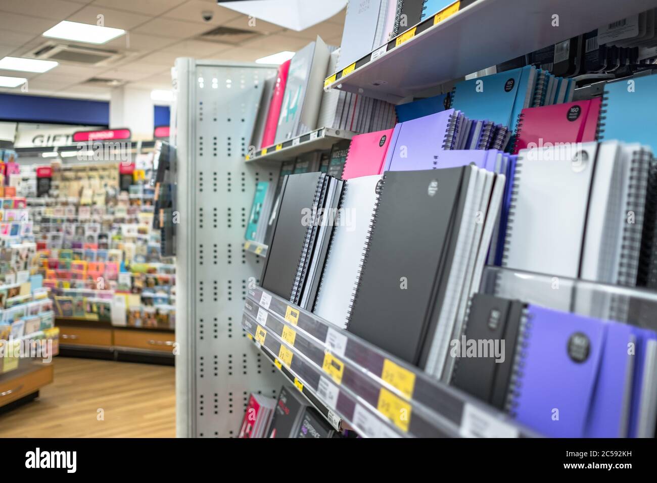 Colourful selection of various sizes and styles of notebooks and other ...