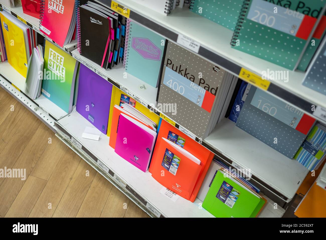 Colourful selection of various sizes and styles of notebooks and other ...