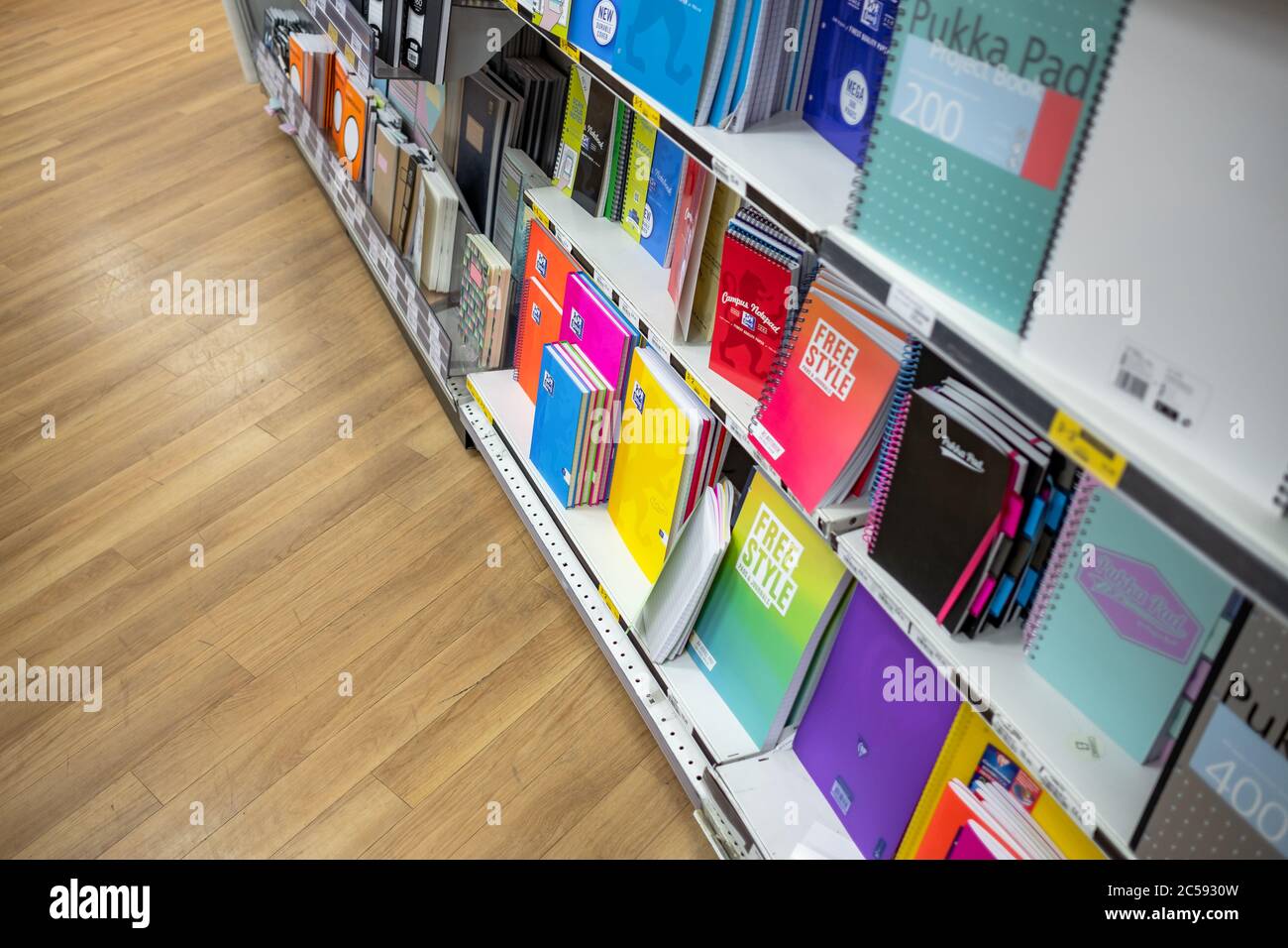 Colourful selection of various sizes and styles of notebooks and other ...