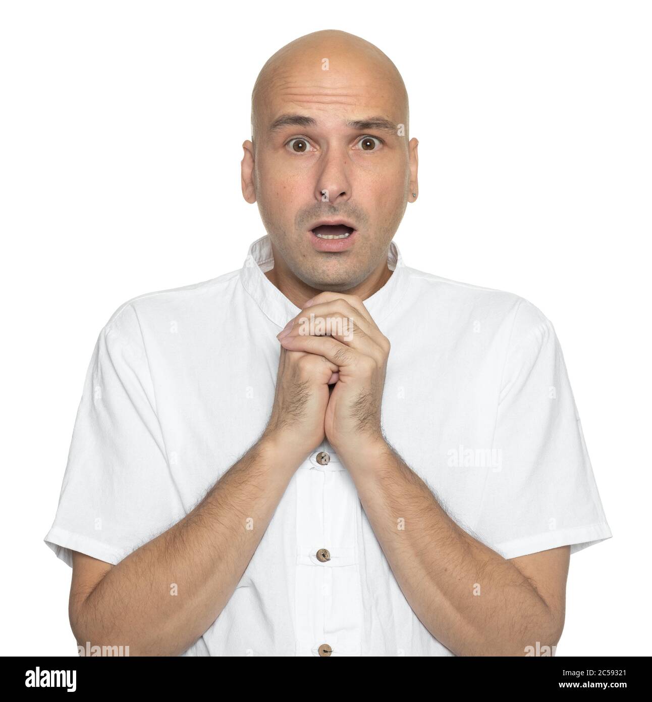 shocked amazed bald man looks directly in camera isolated over white ...
