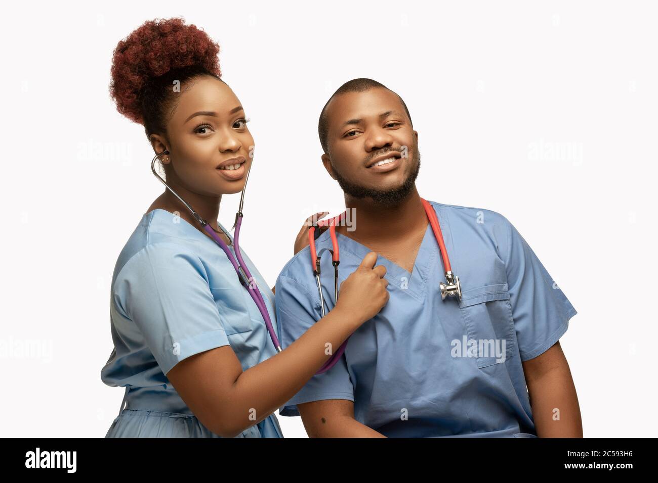 Beautiful couple of young african-american doctors with stethoscopes ...