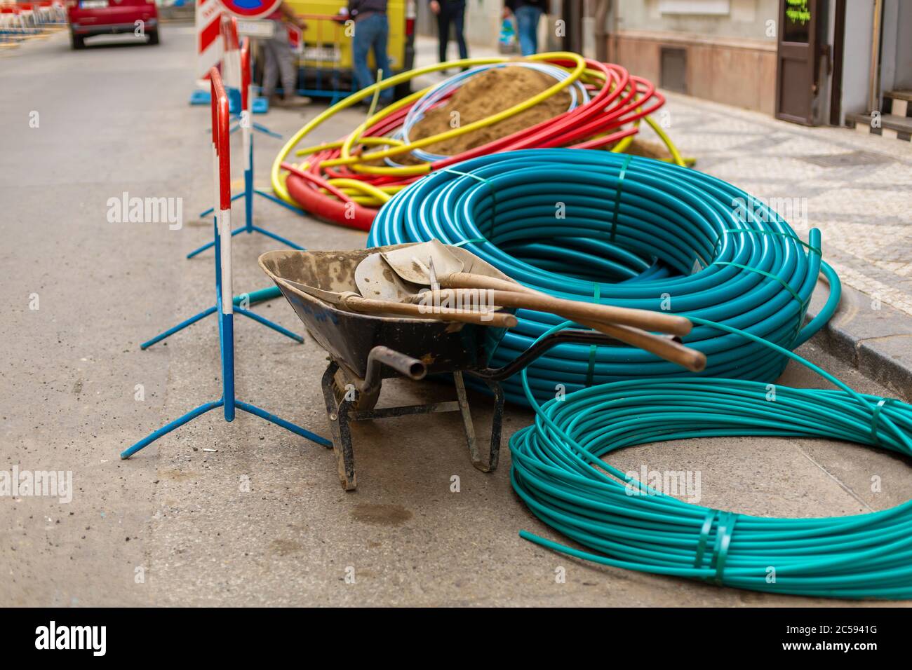 Repair work on city streets. Laying cable routes. Coils of plastic ...