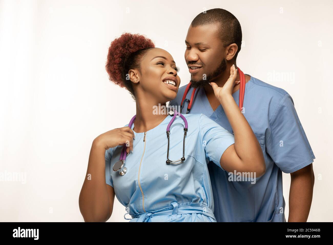 Beautiful couple of young african-american doctors with stethoscopes ...