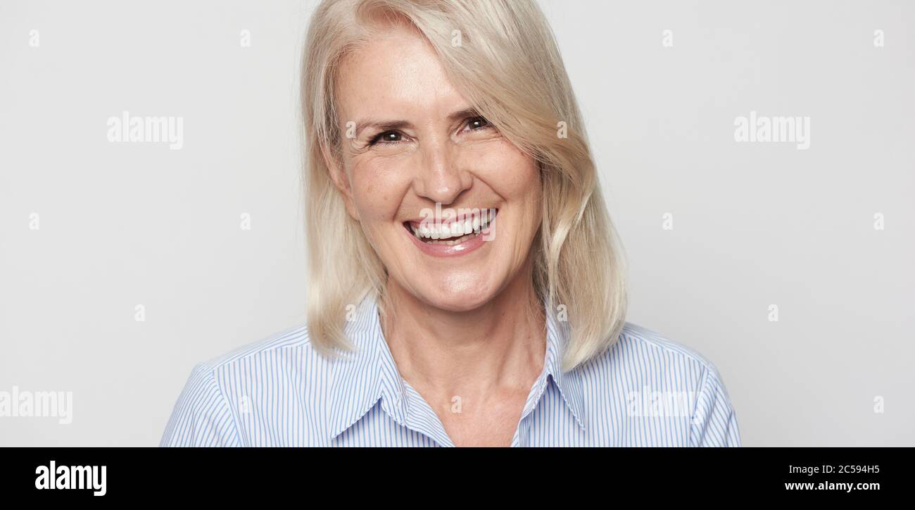Beautiful senior woman is smiling. Isolated. Studio shot Stock Photo ...