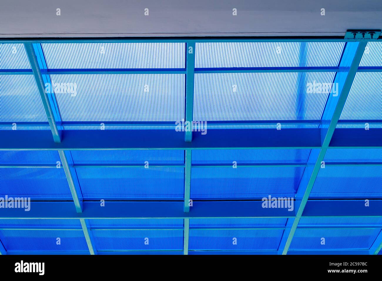 Steel frame and blue polycarbonate plastic roof Stock Photo - Alamy