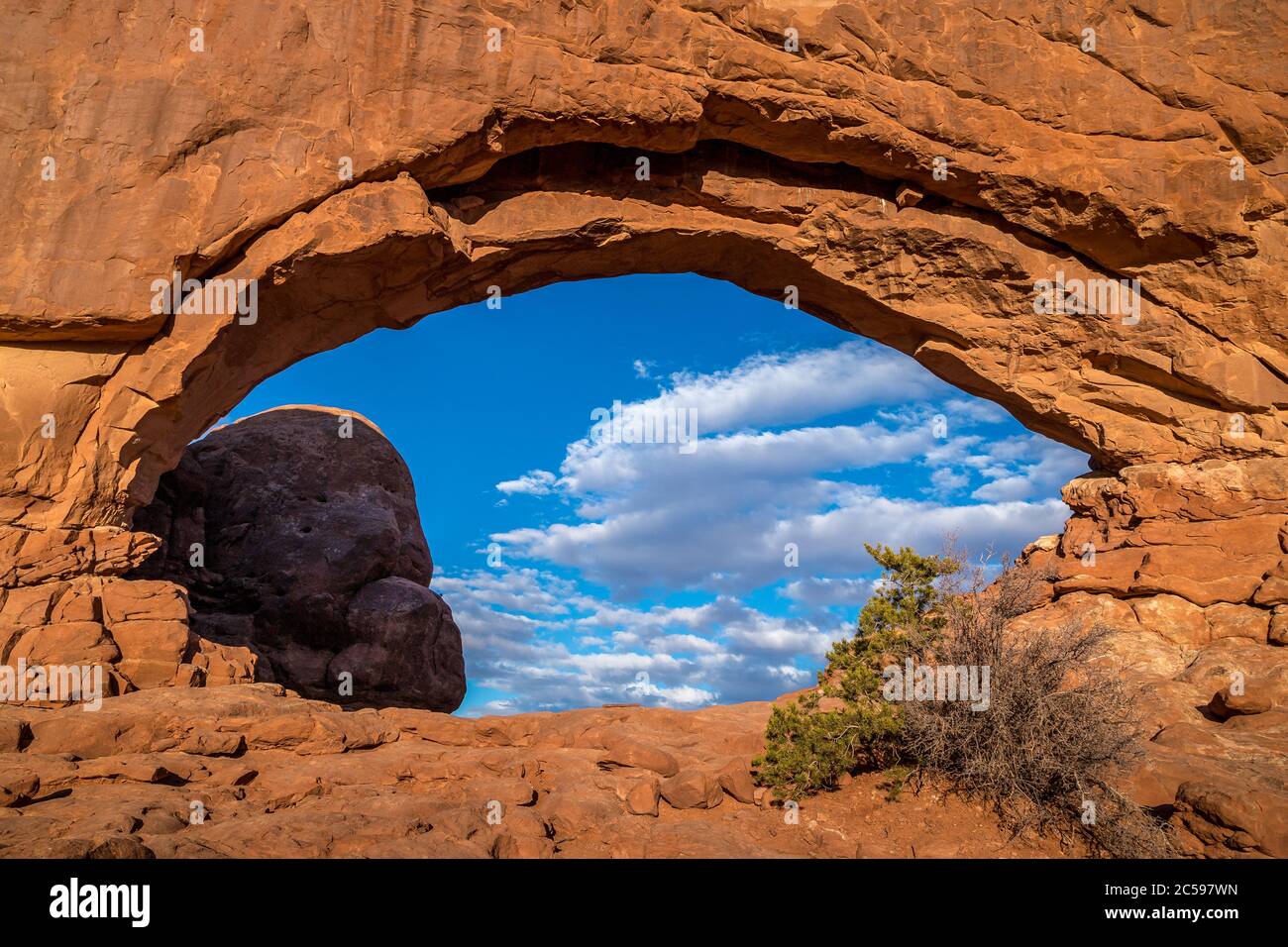 Iconic view looking through North Window Arch with beautiful blue sky ...