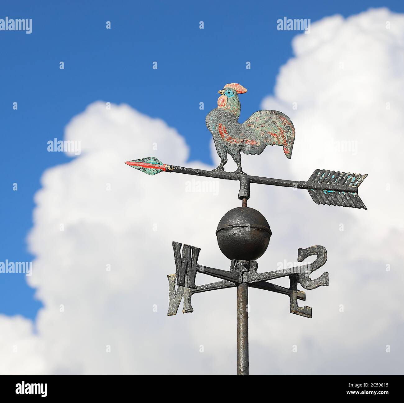 Metallic rooster of a wind vane to indicate the wind direction with the ...