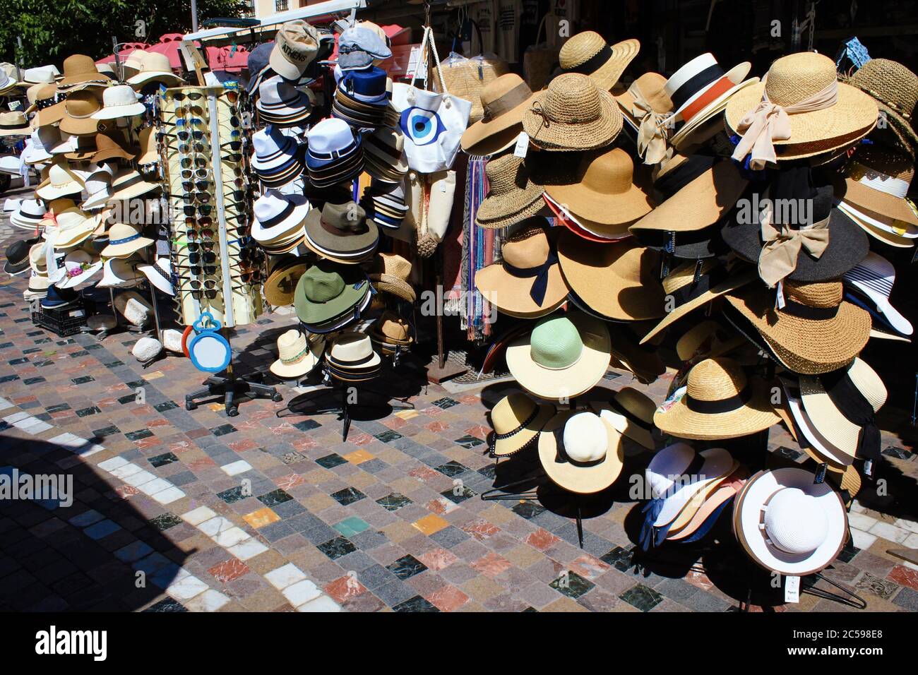 Greece, Athens, June 17 2020 - Hats stacked on stands outside store at ...