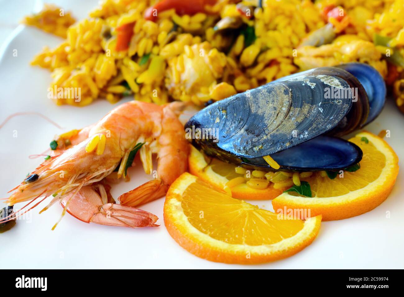 Traditional spanish seafood paella rice on the plate Stock Photo - Alamy