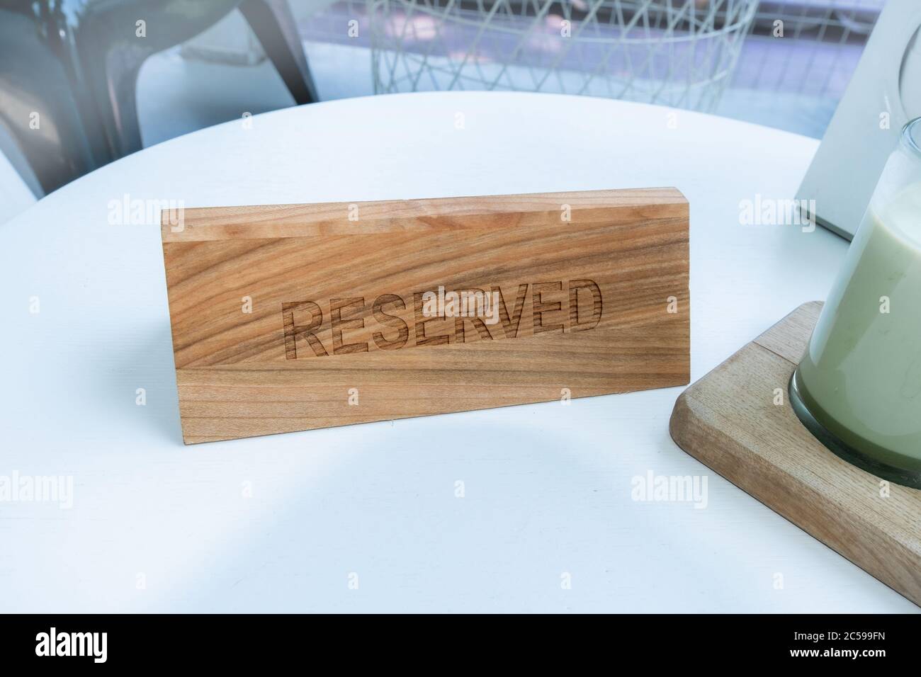 A tag of reservation placed on table. Reserved logo in a restaurant or ...