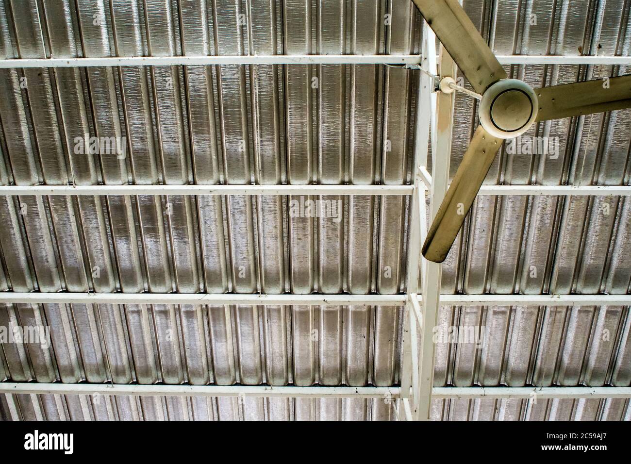 Electric ceiling fan under the metal sheet roof Stock Photo - Alamy
